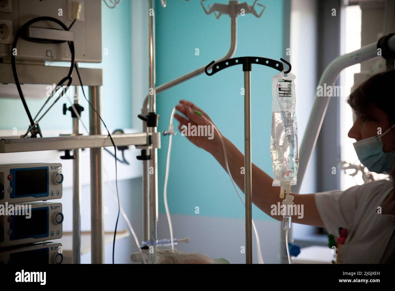 A nurse sets up an infusion, Briancon, France on July 086 2022. Three ...