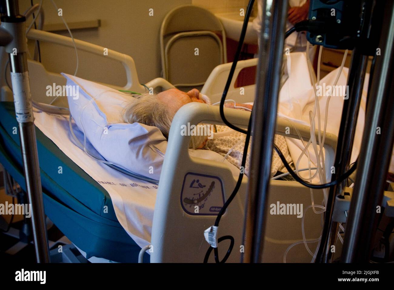 An old woman on oxygen on her bed, Briancon, France on July 06, 2022 ...