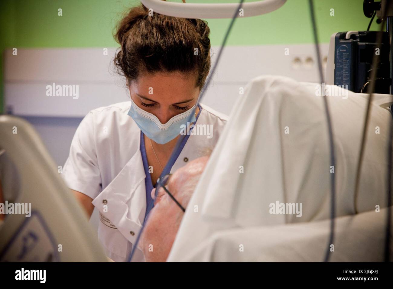 Doctors oscultate through the trachea a patient with Charcot s disease ...