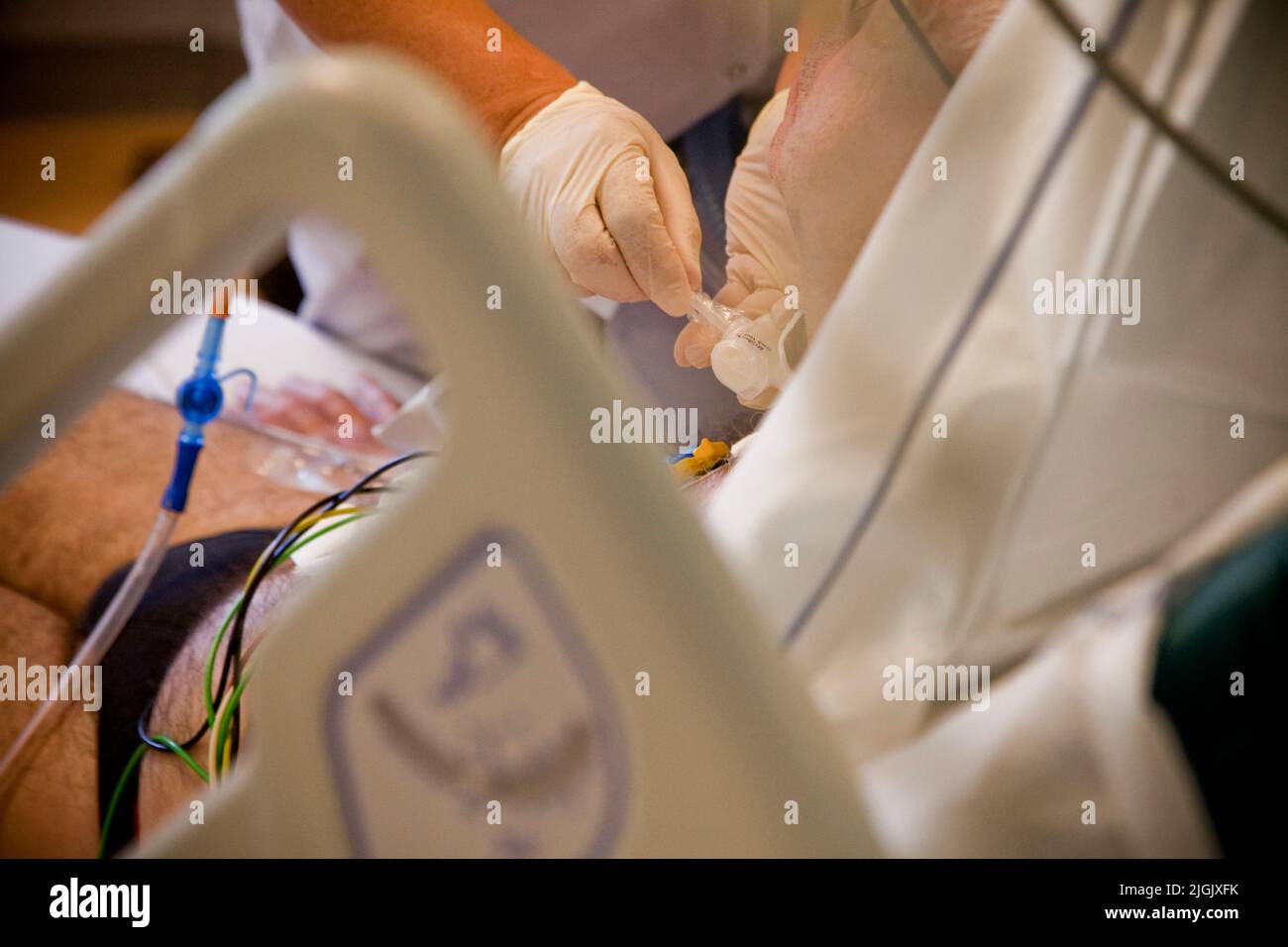 Doctors oscultate through the trachea a patient with Charcot s disease ...