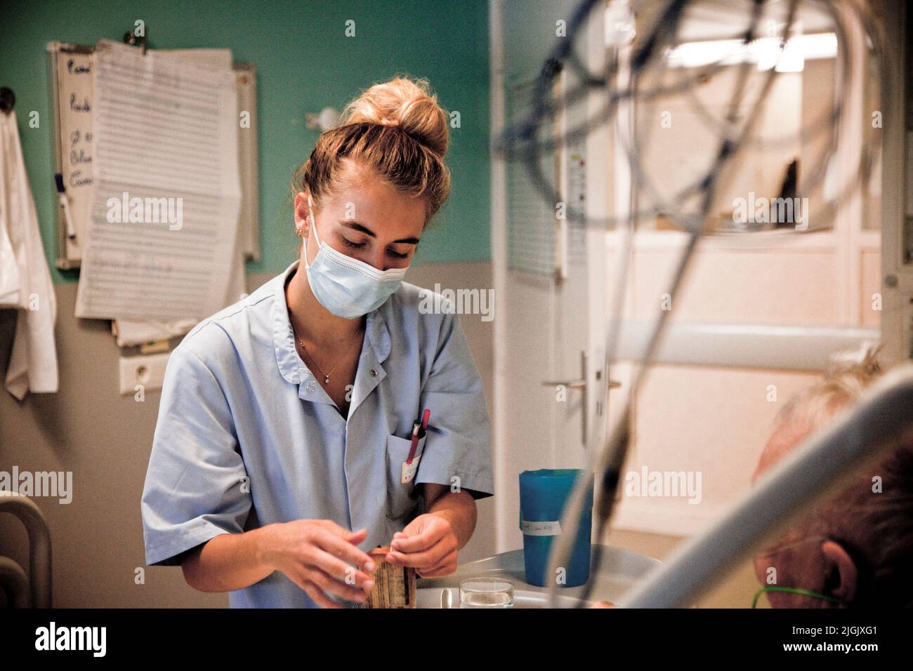 A nurse helping a patient to eat, Briancon, France on July 08, 2022 ...