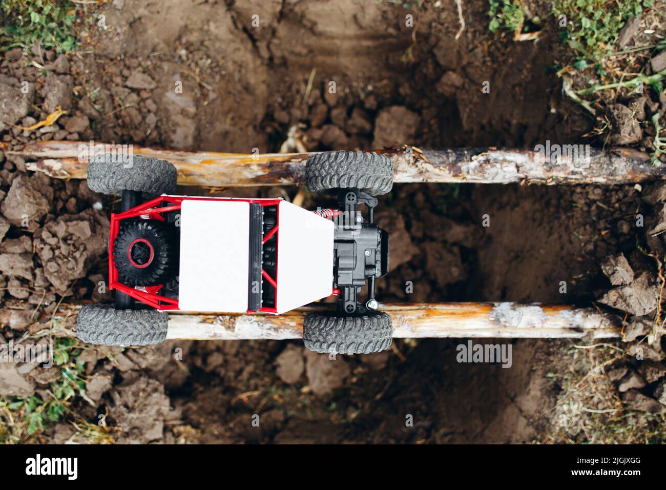 Rc car above yawner on logs top view Stock Photo - Alamy