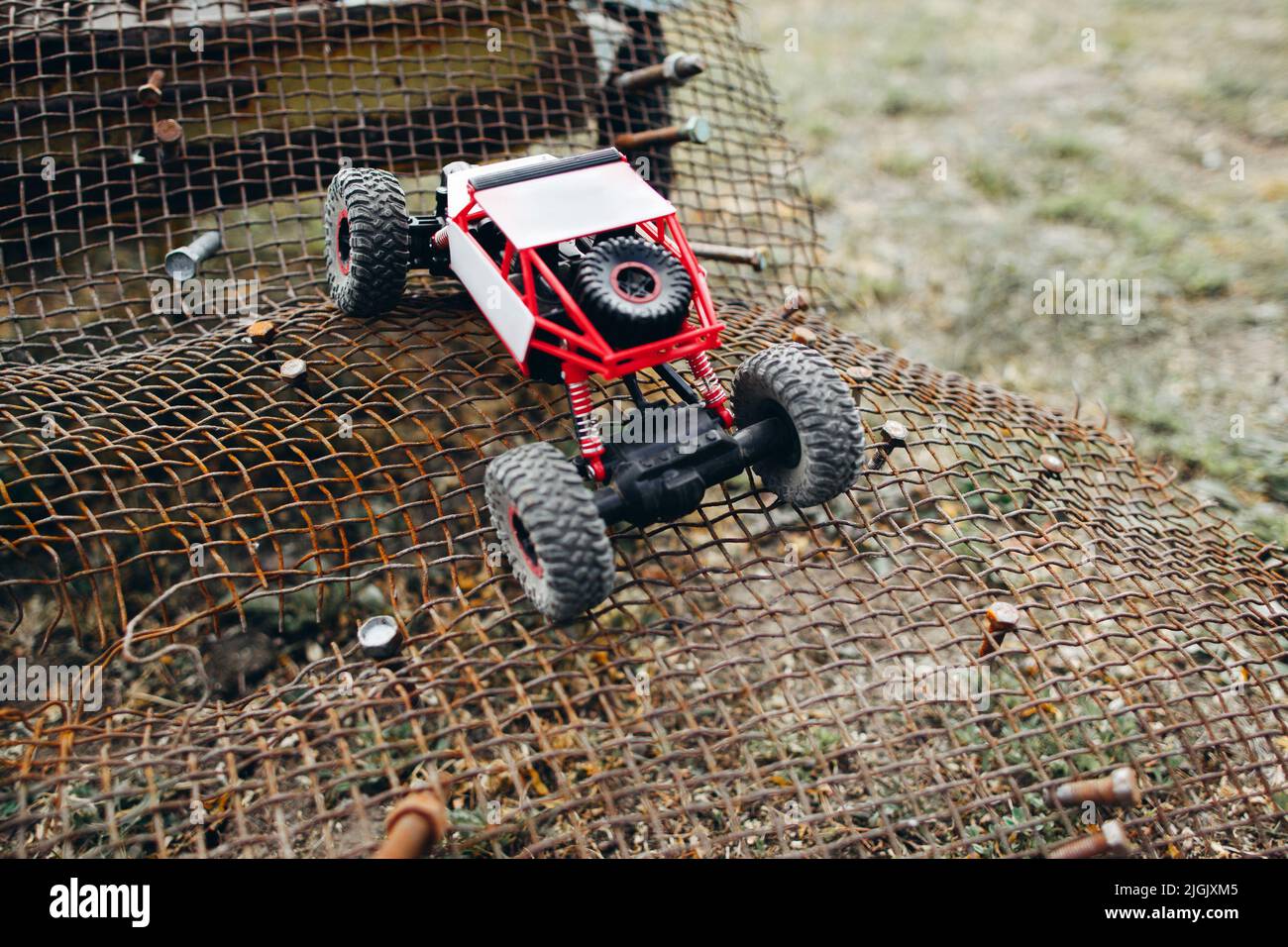 RC crawler riding rough surface og grille Stock Photo - Alamy