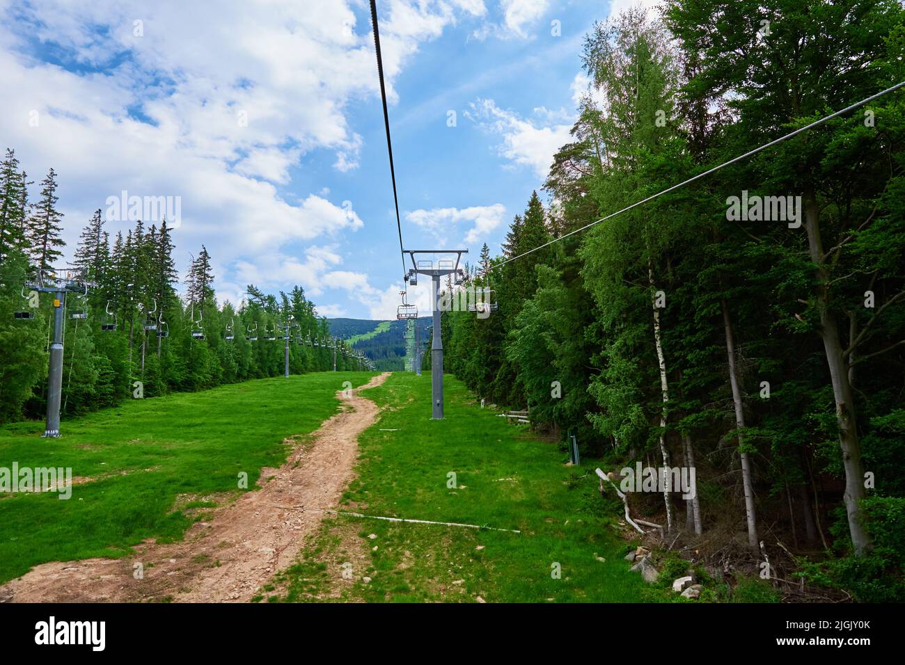 Beautiful mountains, covered with forest and open cable car line ...