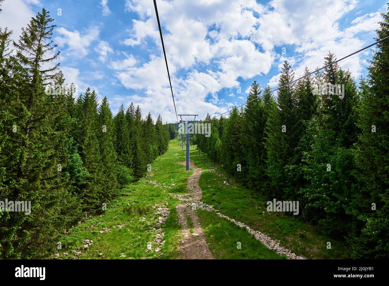 Open cable car line. Karpacz resort in Poland with lift road. Chairlift ...
