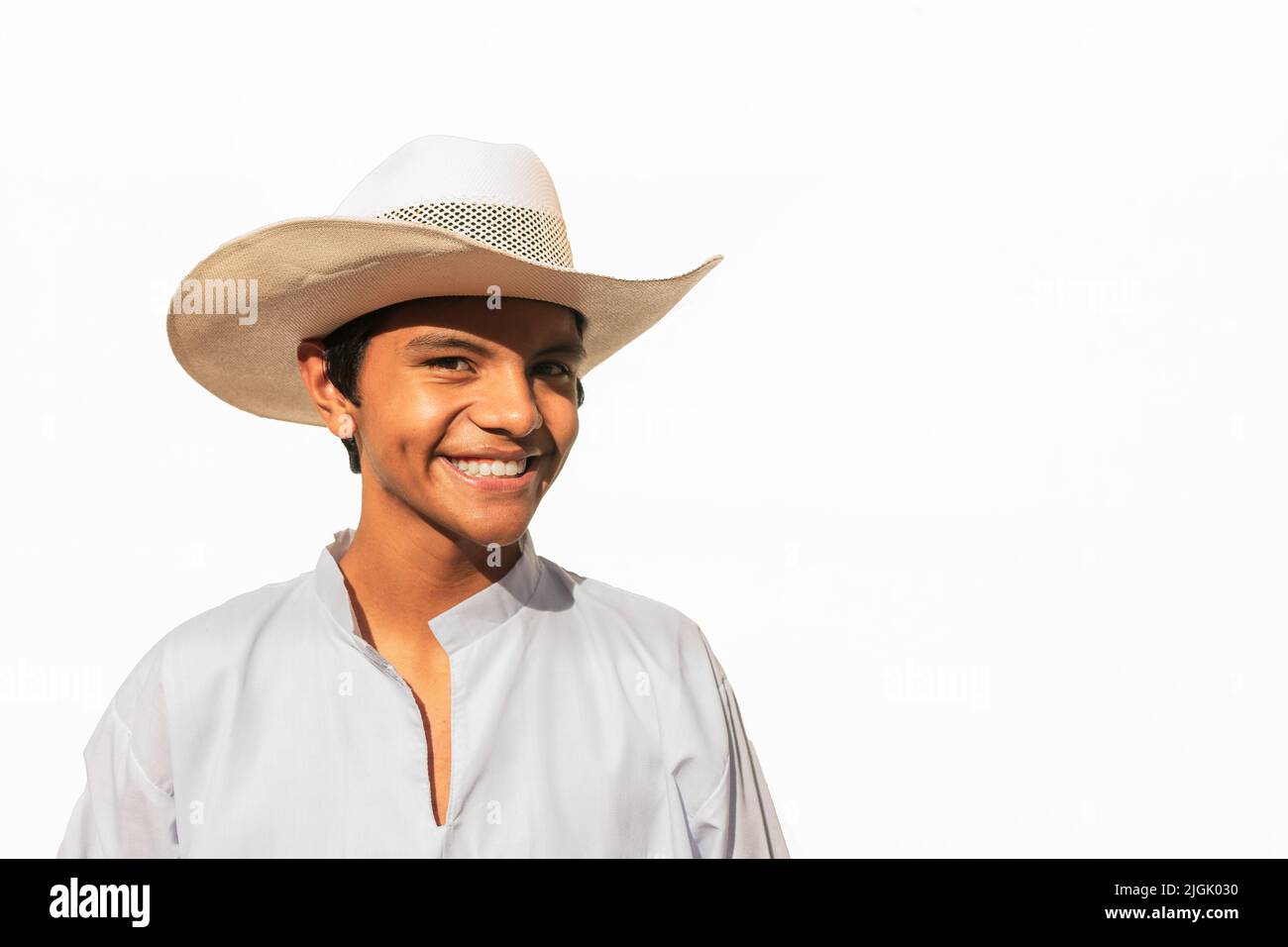 Male teenager with hat and traditional clothes from latin america ...