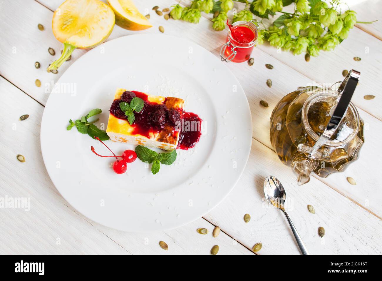 Cheesecake with red topping and tea, top view Stock Photo - Alamy