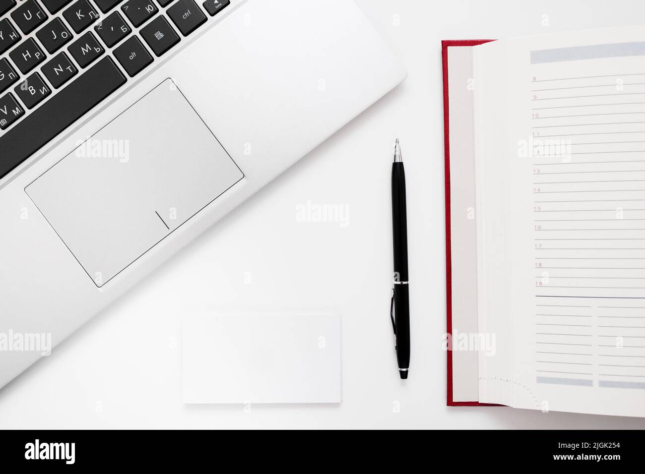 Laptop keyboard, pen and notebook flat lay Stock Photo - Alamy