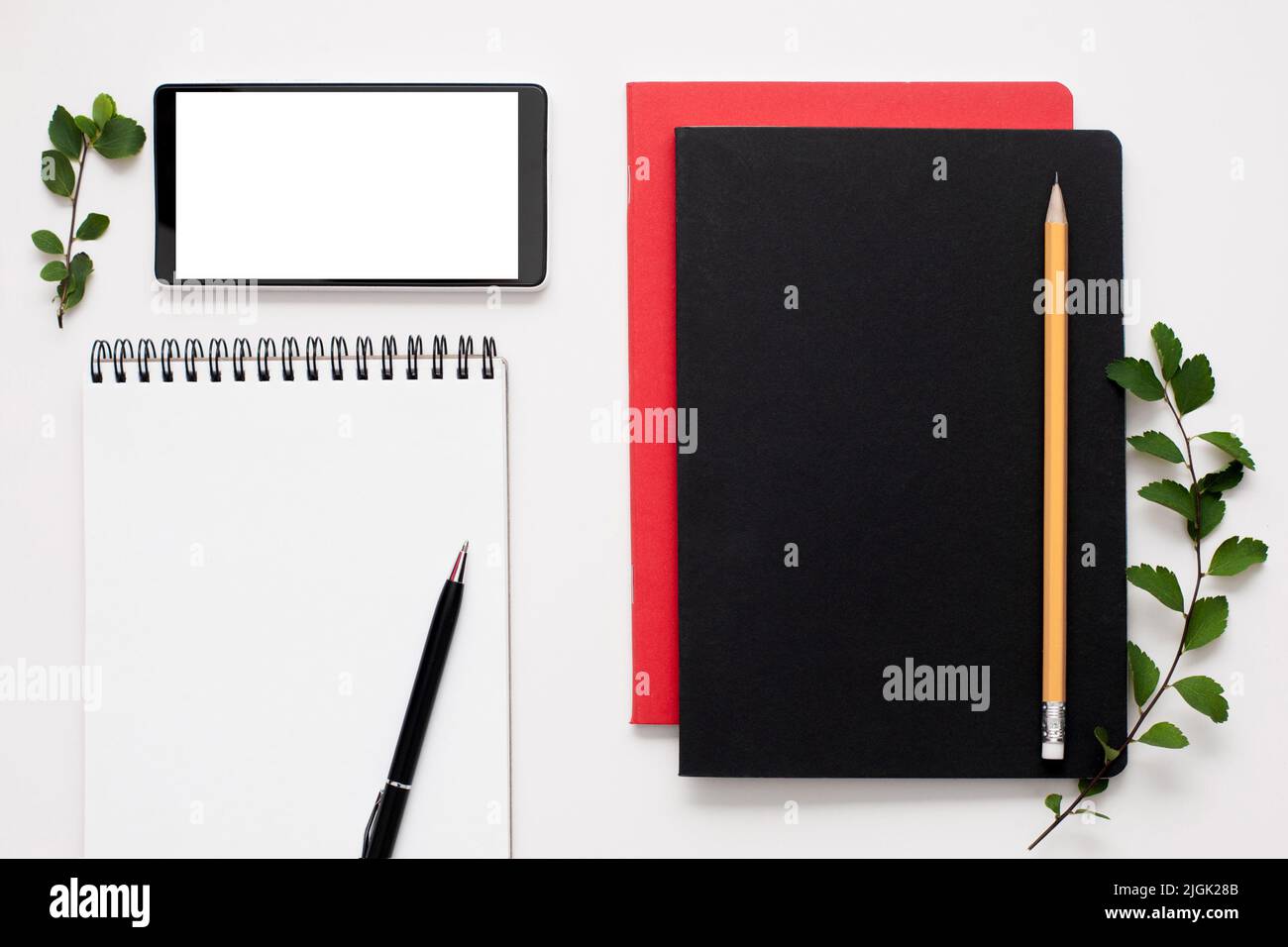 Blank notepad and smartphone screen with supplies Stock Photo - Alamy