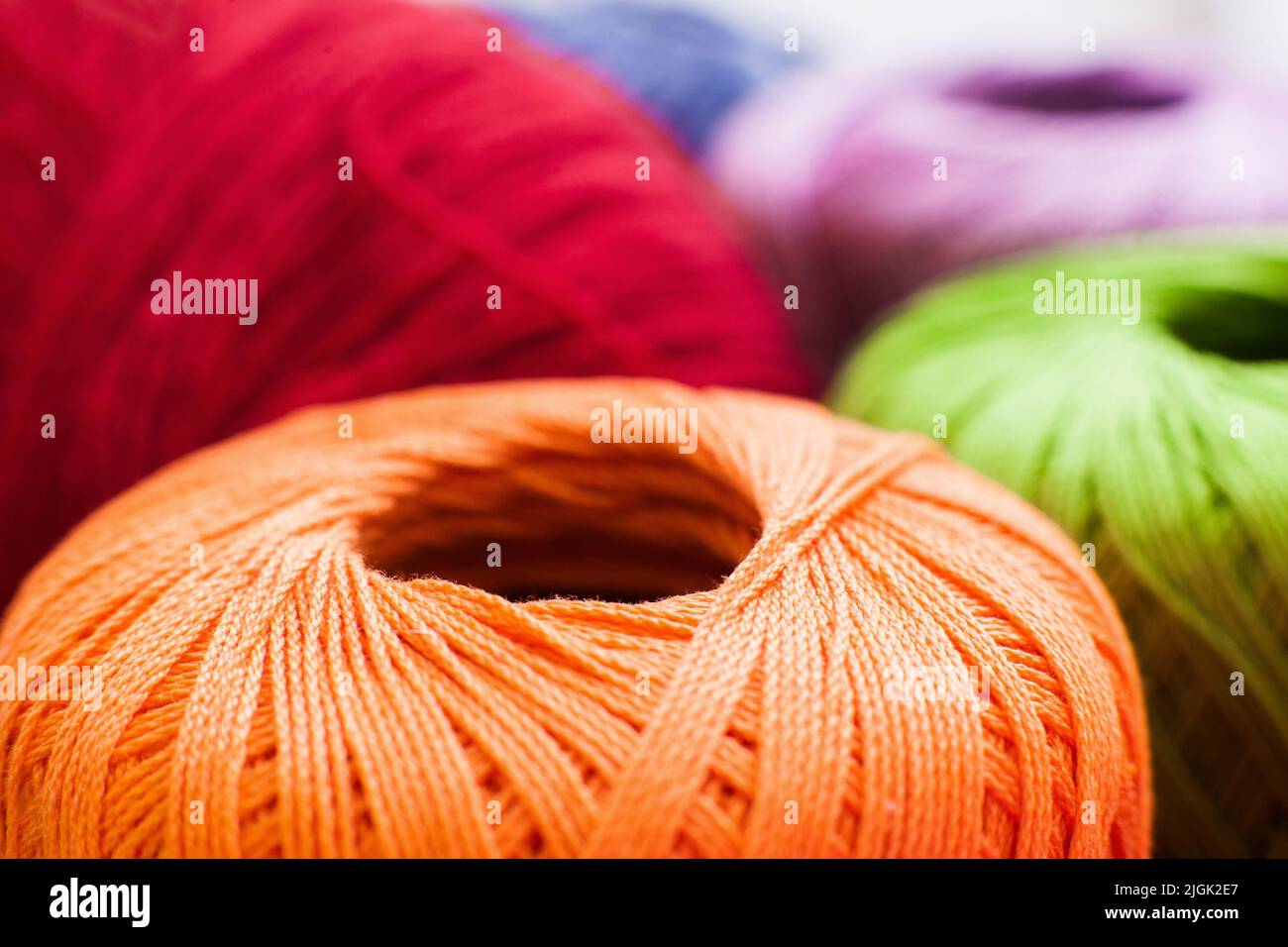 Colorful balls of yarn background, close-up Stock Photo - Alamy