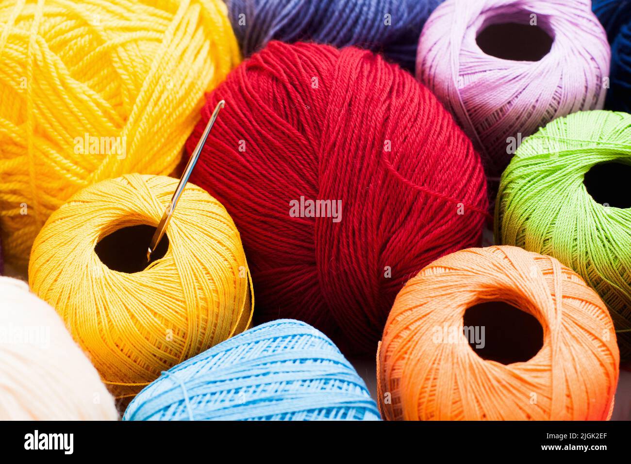 Crochet and colorful knitting thread background Stock Photo - Alamy