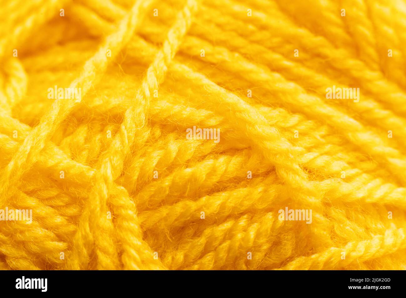 Yellow knitting thread texture, handiwork backdrop Stock Photo - Alamy
