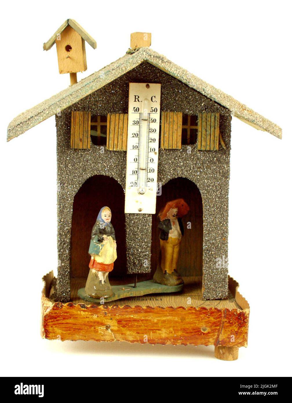 Barometer Barometer with thermometer. Small house of wood with old man ...