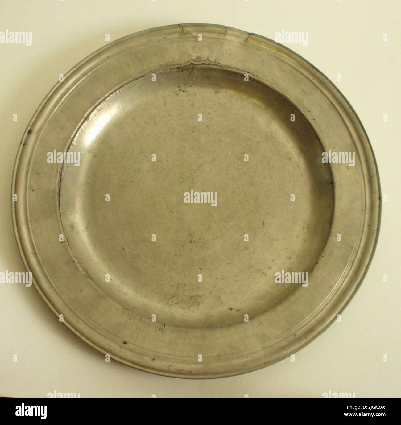 Fat Tin dish, large with pressed edge, bottom partly loose. Labeled ...