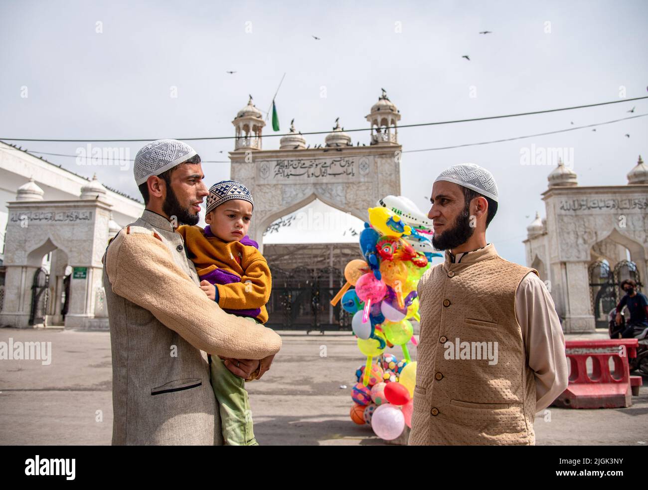 Muslim men greet each other on the occasion of Muslim festival Eid at ...