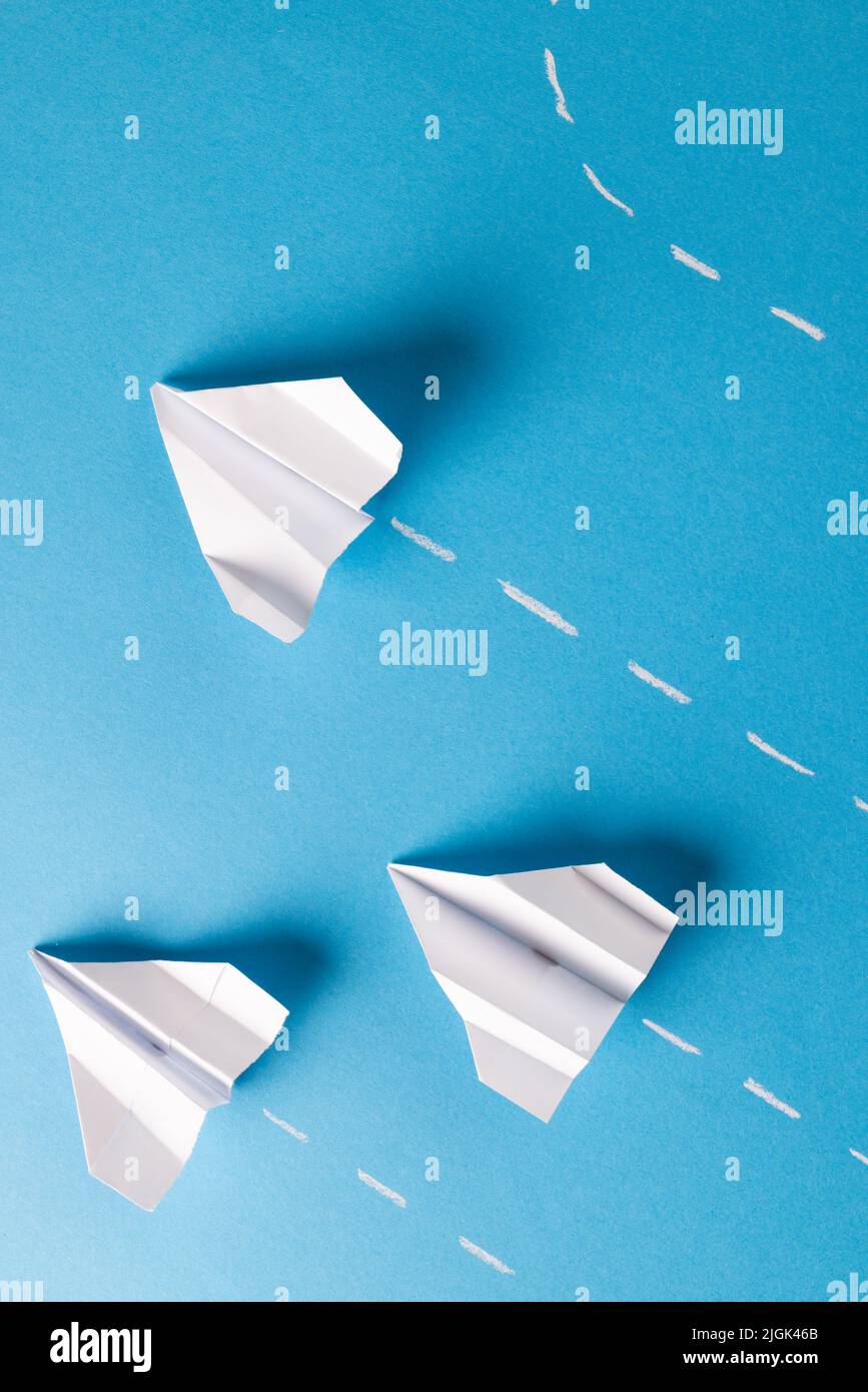 Image of three white paper plains and lines on blue background Stock ...