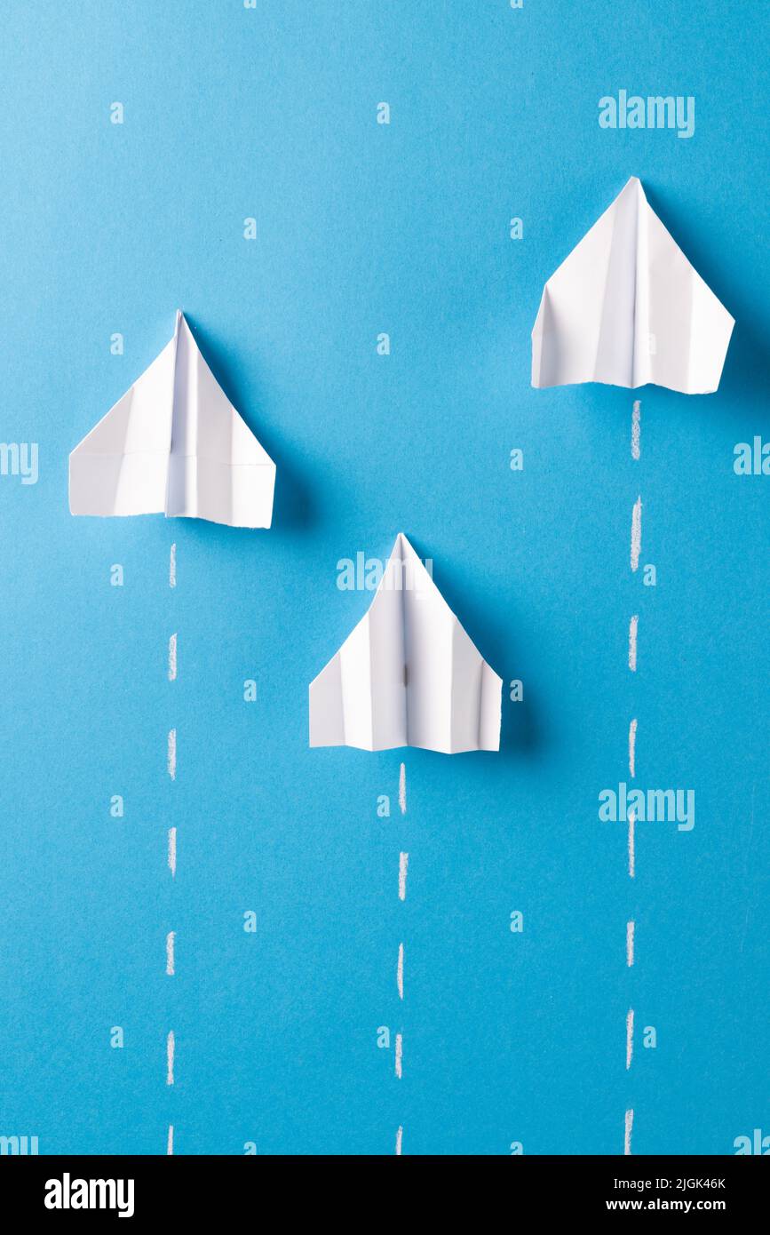 Image of three white paper plains and lines on blue background Stock ...