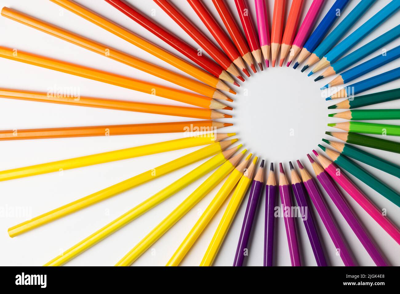 Central composition of colorful crayons on white surface Stock Photo ...