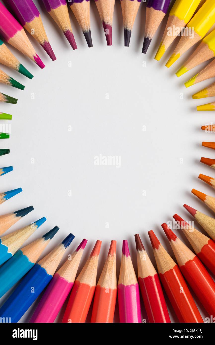Vertical central composition of colorful crayons on white surface Stock ...