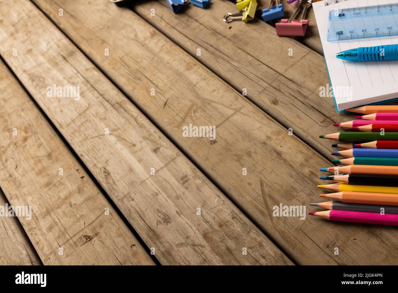 Composition of diverse school tools on wooden surface Stock Photo - Alamy
