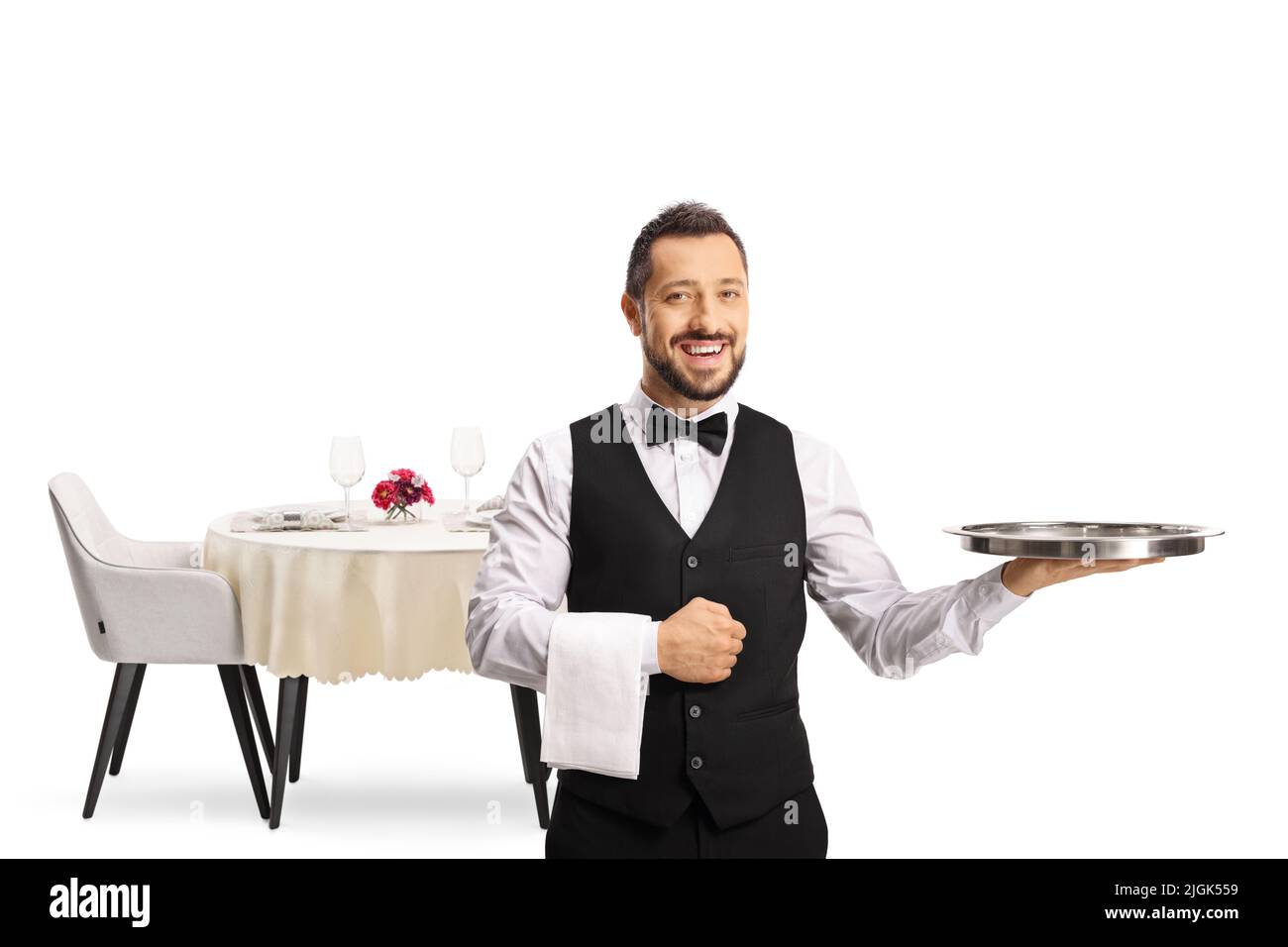 Full length portrait of a smiling server holding a tray and standing in ...