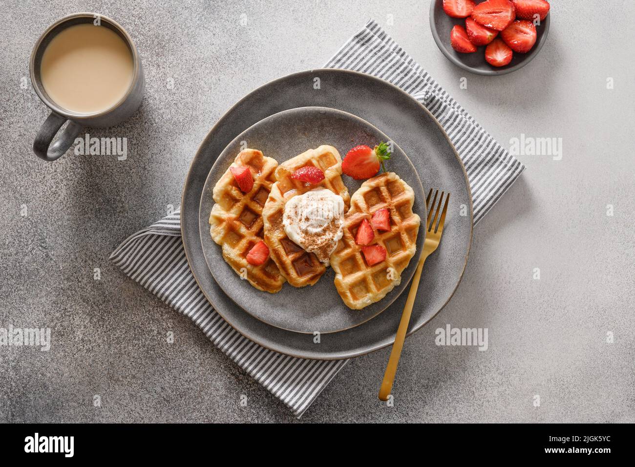 Trendy breakfast with croffles and morning coffee, strawberries on gray ...