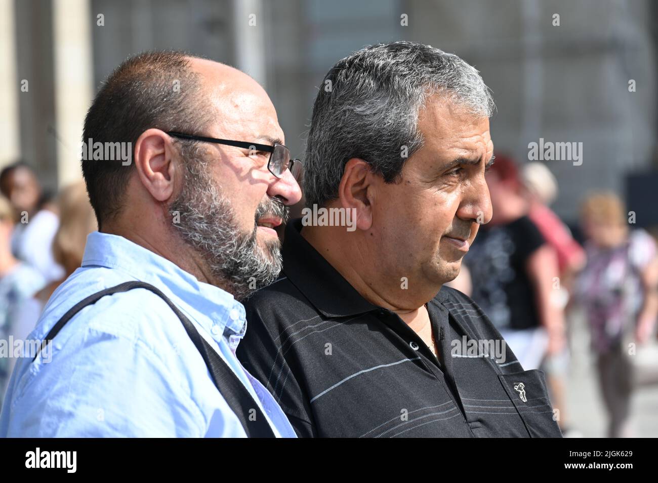 Two gray-haired men look interestedly in the same direction Stock Photo ...
