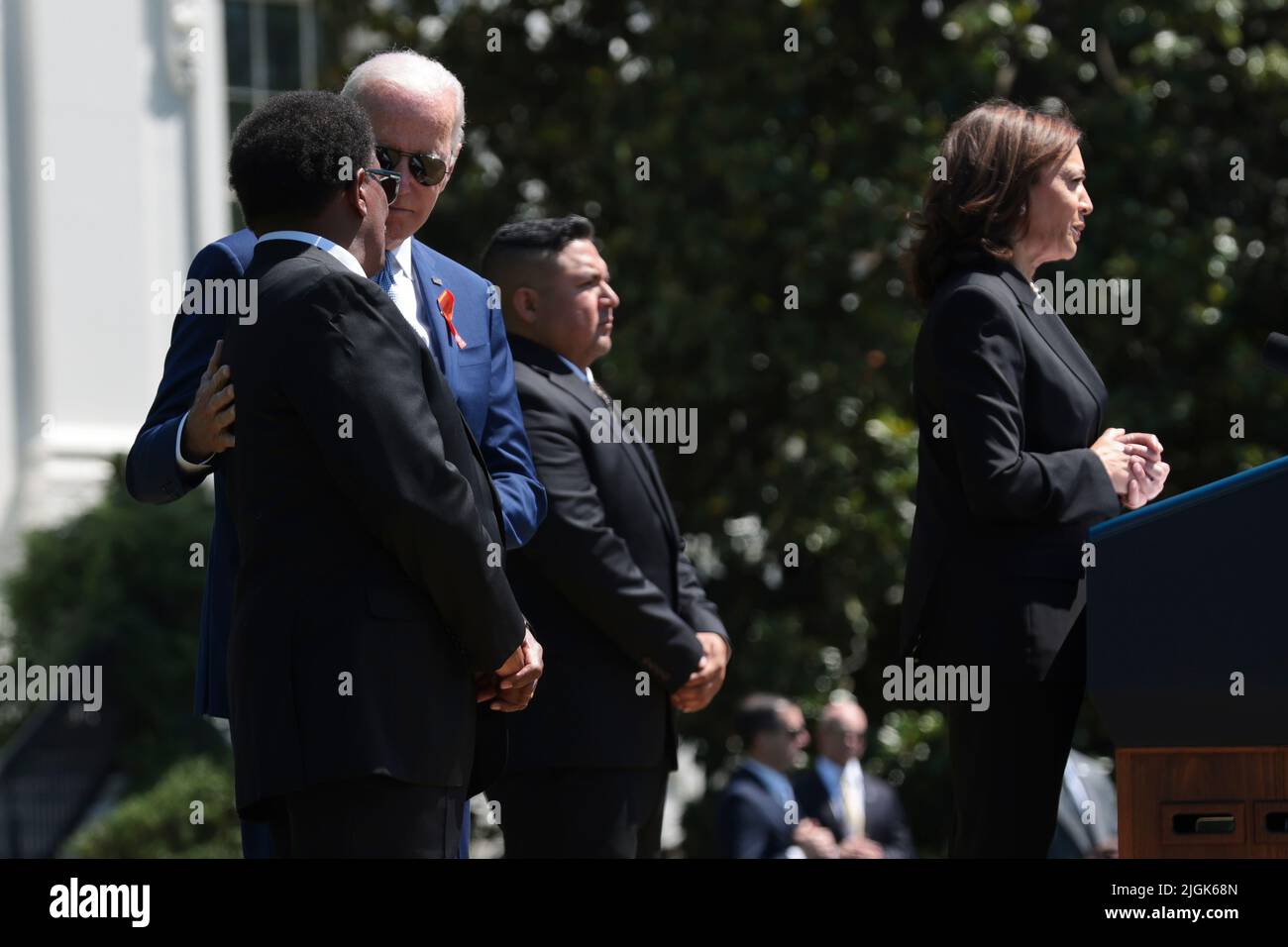 U.S. President Joe Biden embraces Garnell Whitfield Jr., the son of ...