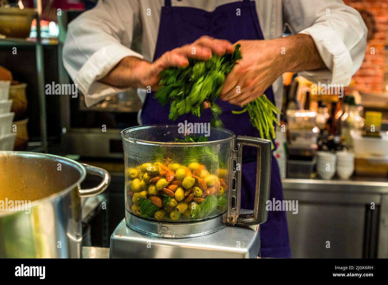 Cooking workshop in the market hall of Avignon, France. Almonds, olives ...