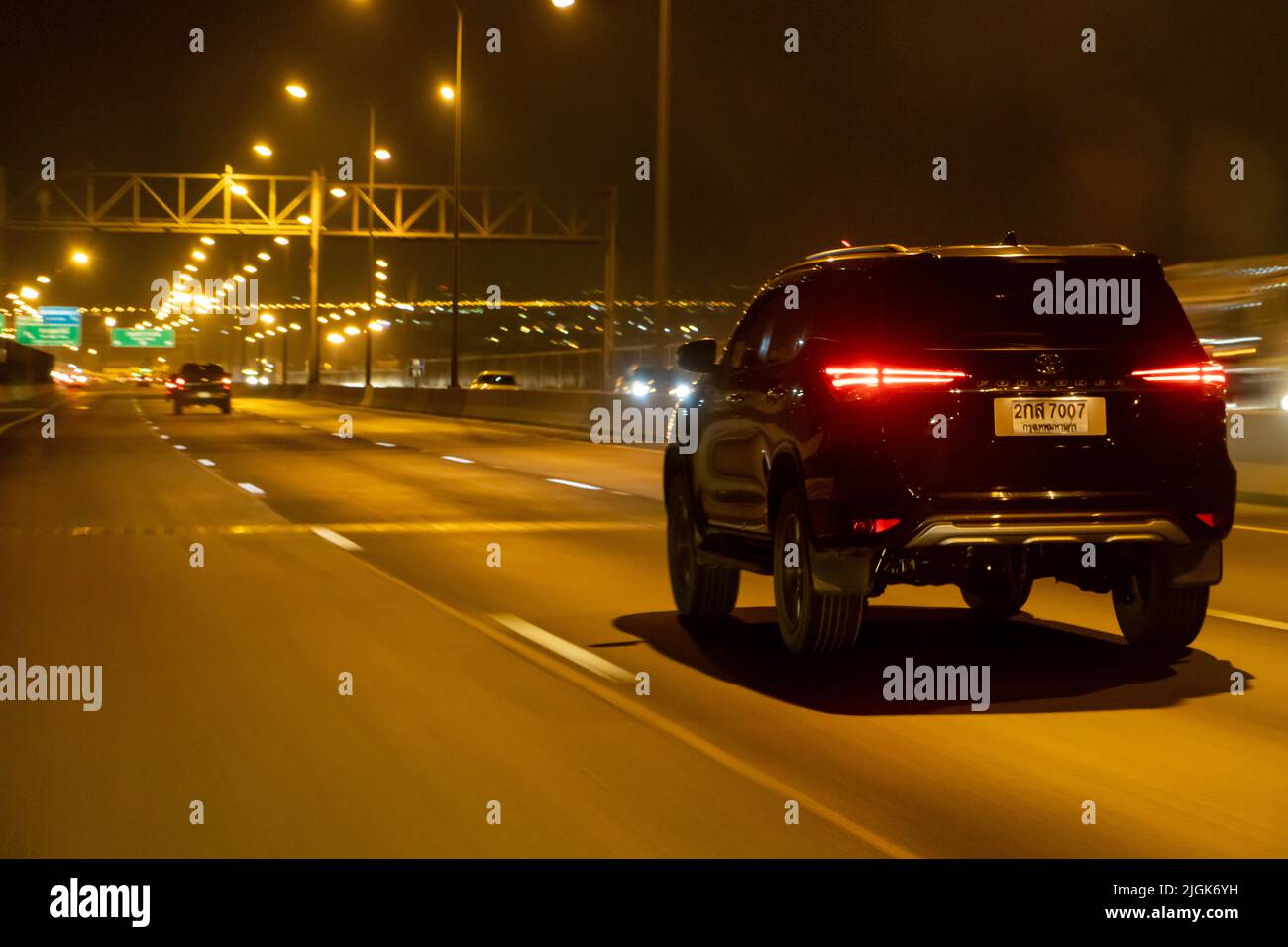 BANGKOK, THAILAND, APR 15 2022, A suv car is driving on the night ...
