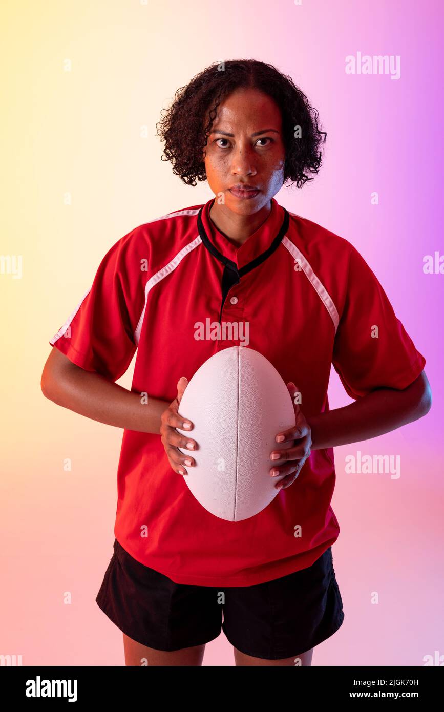 Portrait of african american female rugby player with rugby ball over ...