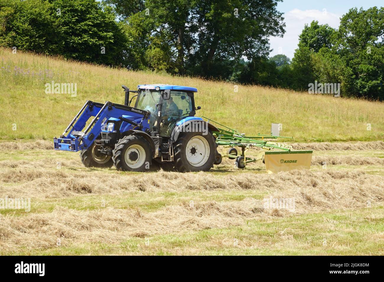 Tractor bailing hay hi-res stock photography and images - Alamy
