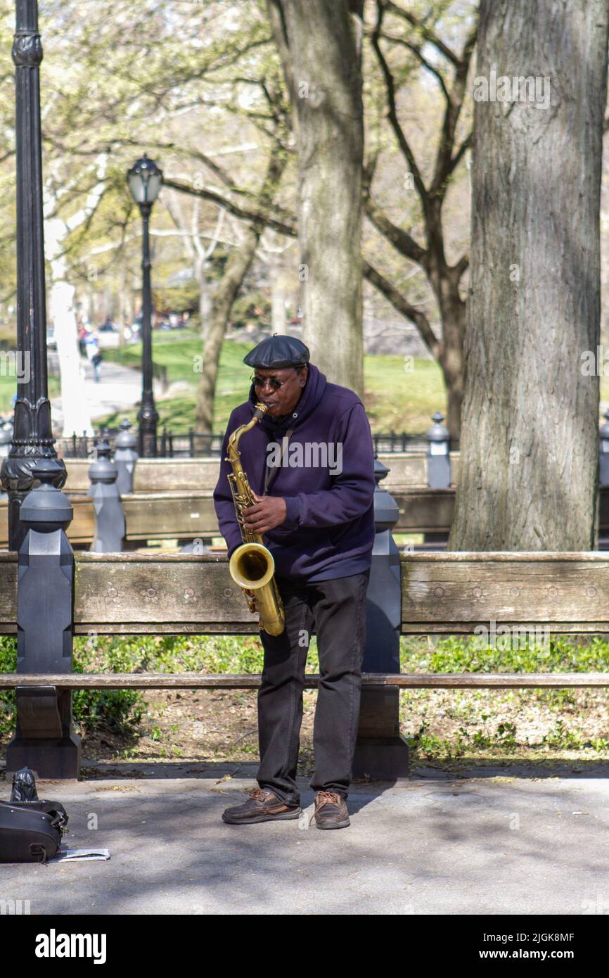 Lone African American saxophone player in Central Park Stock Photo - Alamy