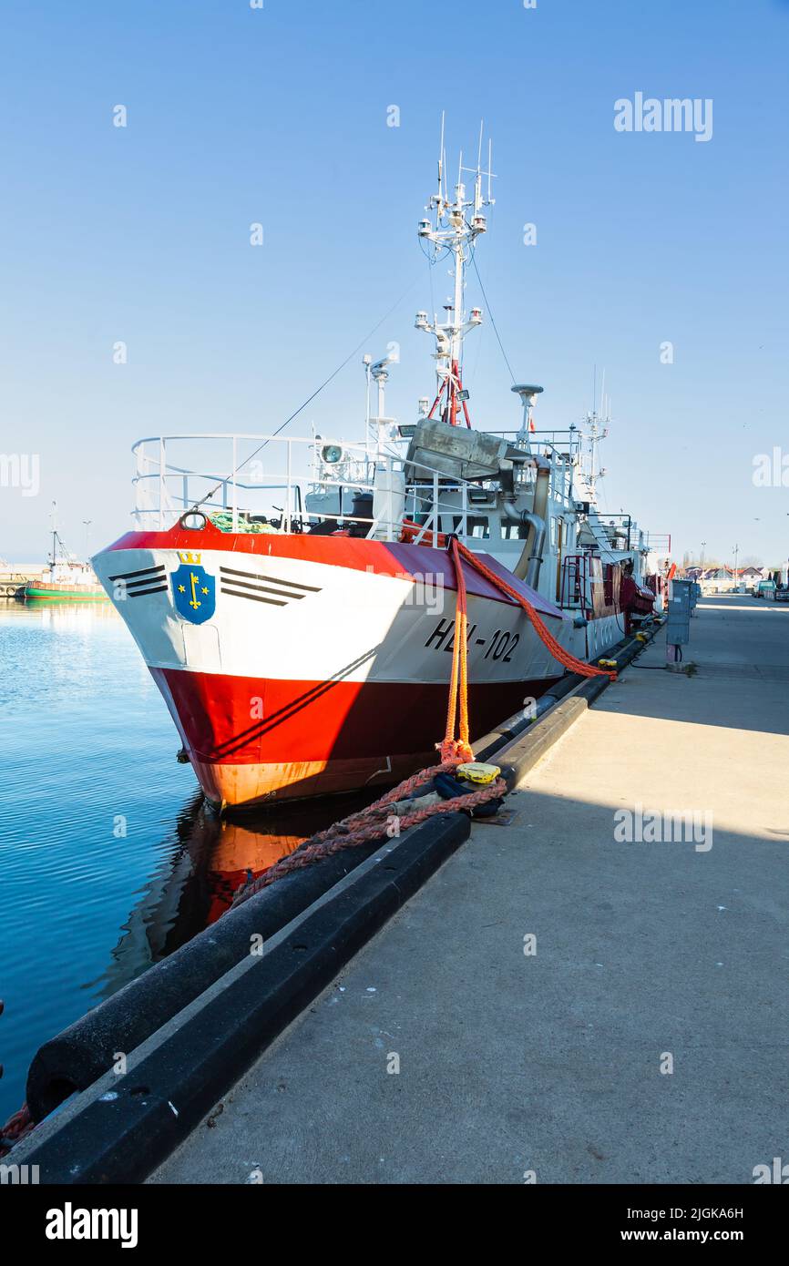 May, 02, 2022: Red and white fishing boat with coat of arms of Hel on ...