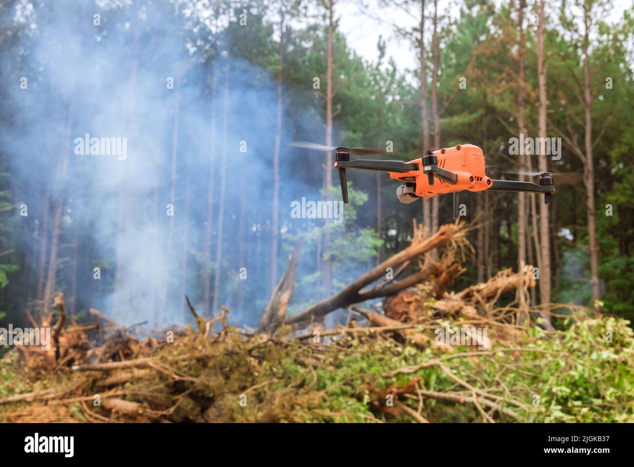 In the forest, fire services are using a drone to follow the fire into ...