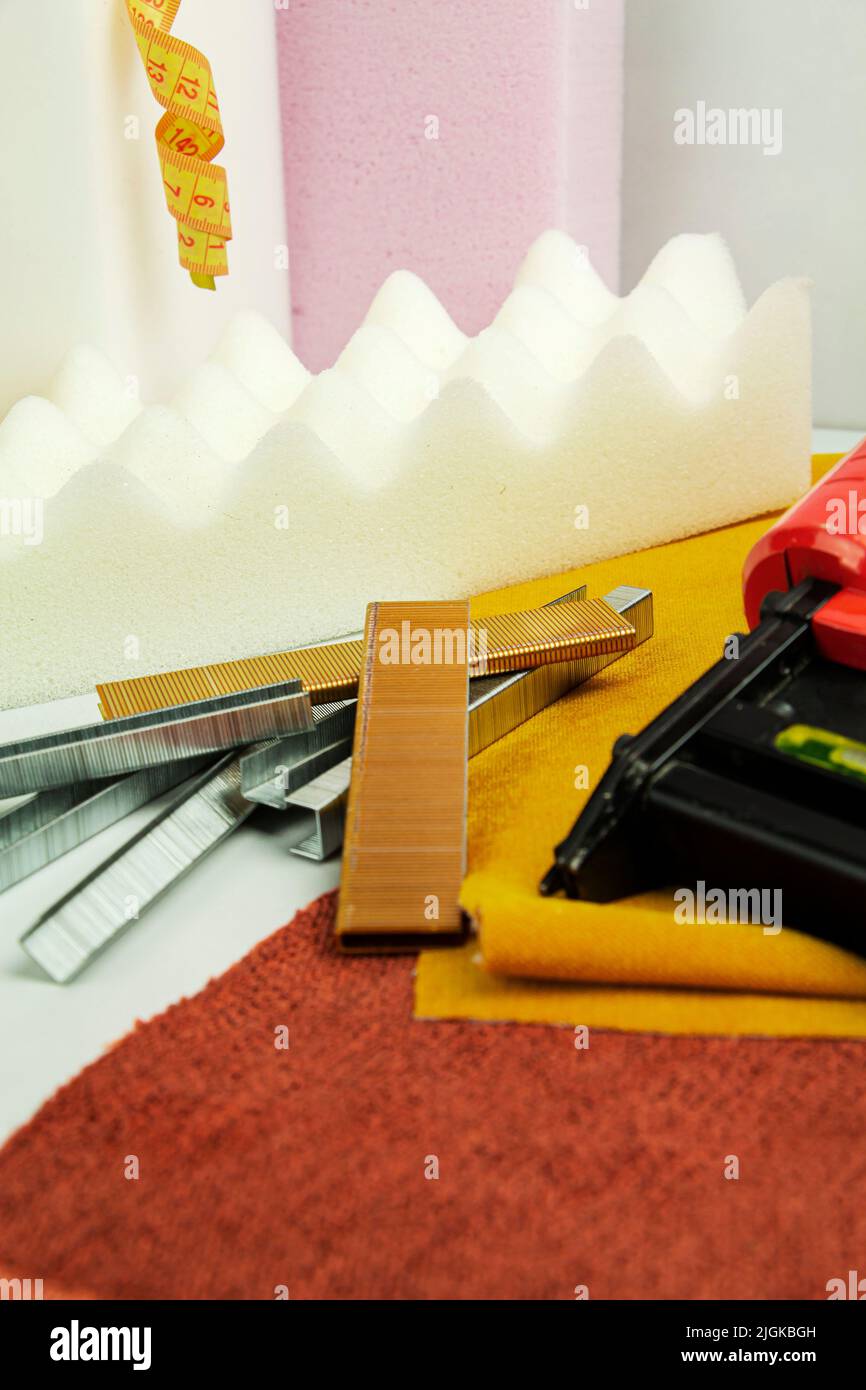 concept of furniture production and repair. Stapler and staples ...