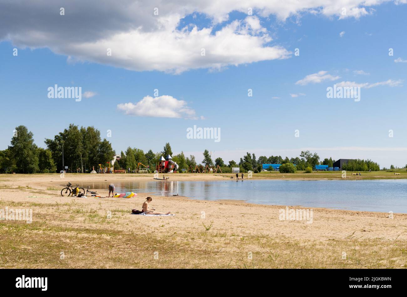 Estonia beach; people on the beach sunbathing in summer on the Baltic ...