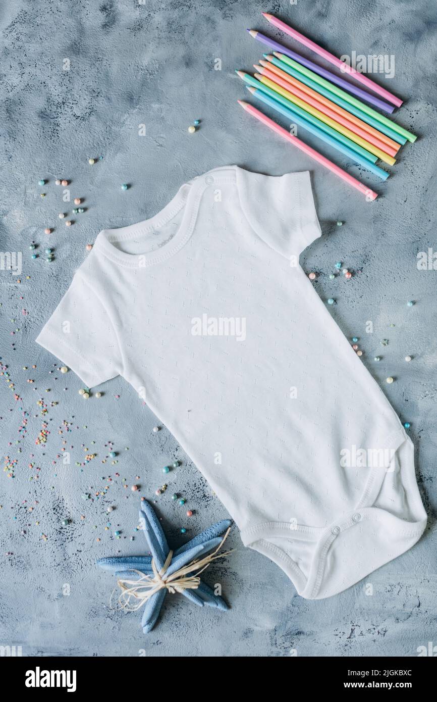 white baby clothes, newborn baby costume mockup Stock Photo - Alamy