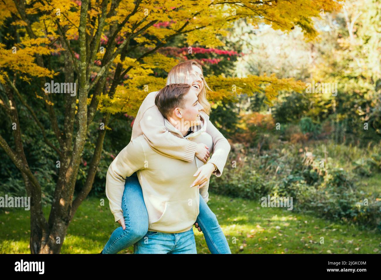 Young caucasian couple in love having fun during a walk in nature ...