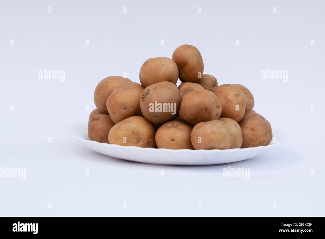 Baby potatoes small round potato from india on white background Asian ...