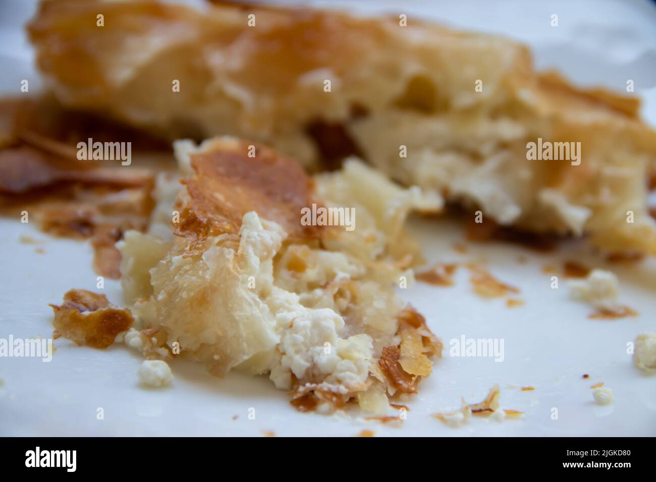 Very popular Turkish burek meal filled by cheese served at the plate in ...