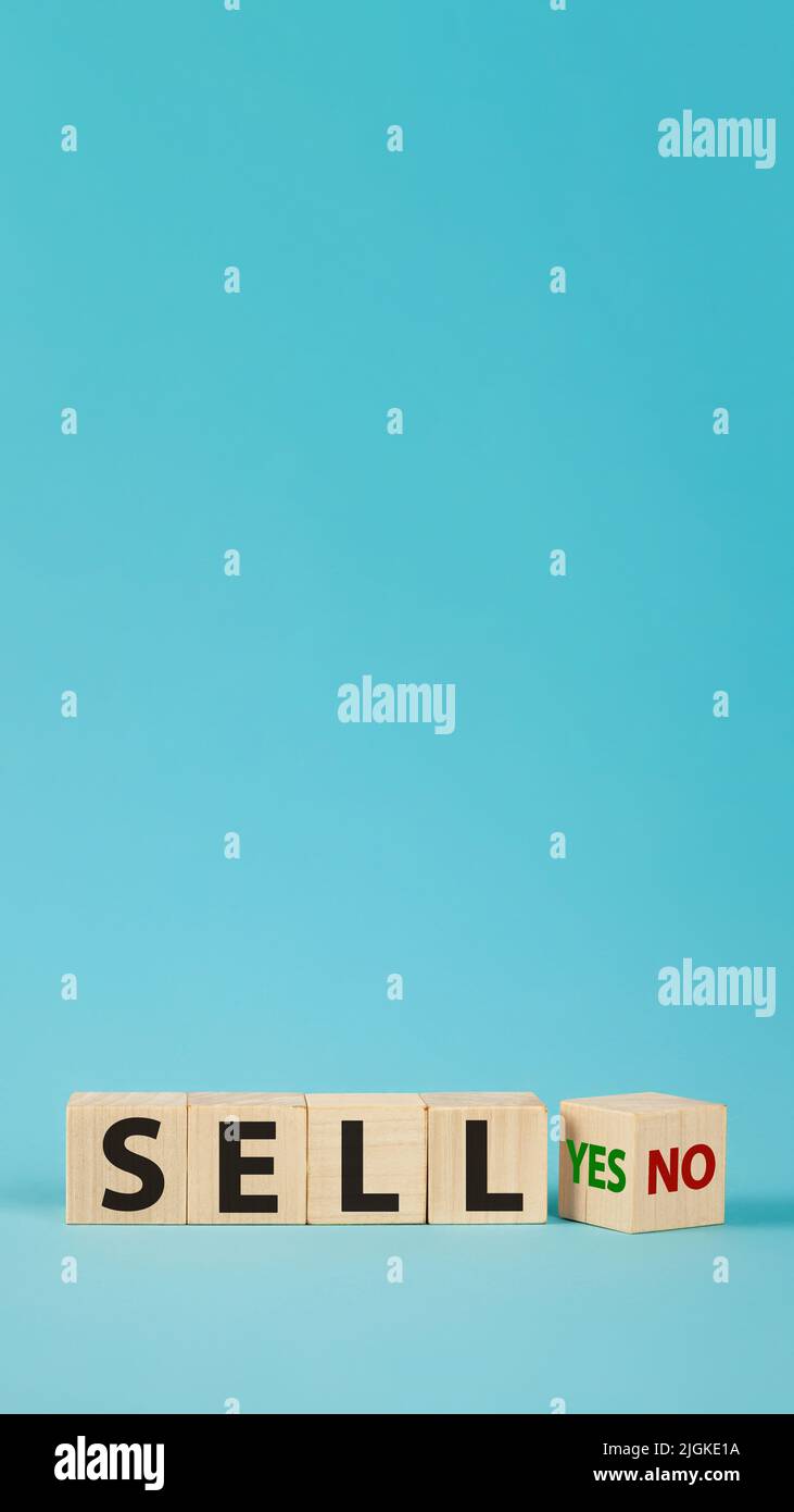 Time to sell. Cubes with the word SELL Hand turns a cube and changes ...