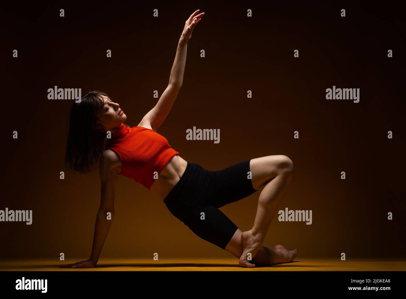 Ballerina is doing a great ballet pose on the ground Stock Photo - Alamy