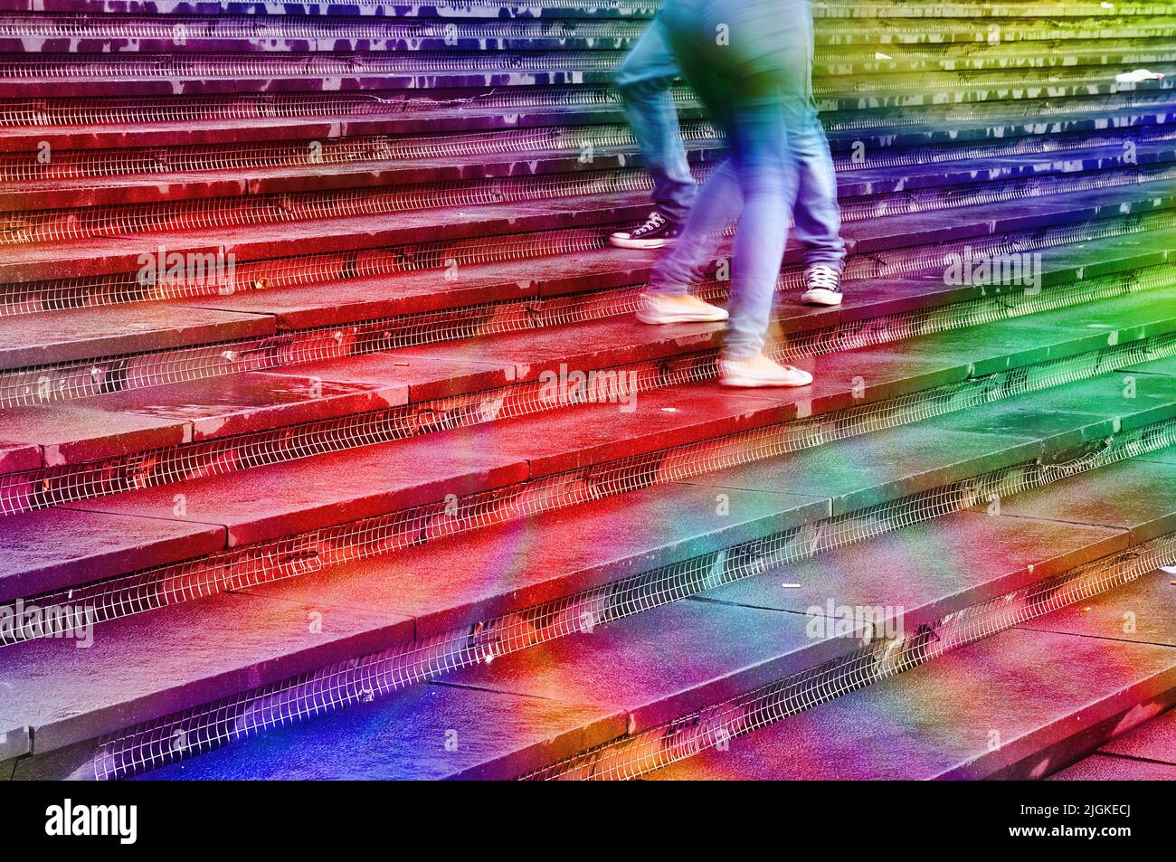 Softly textured image in rainbow colors of young peoples feet dancing ...
