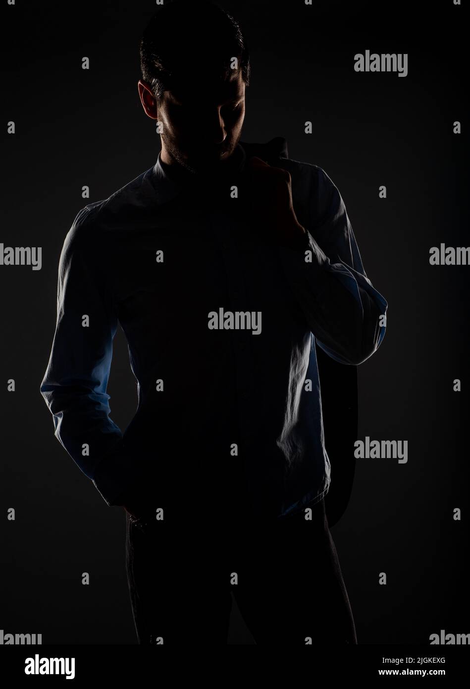 Dimmed light man hi-res stock photography and images - Alamy