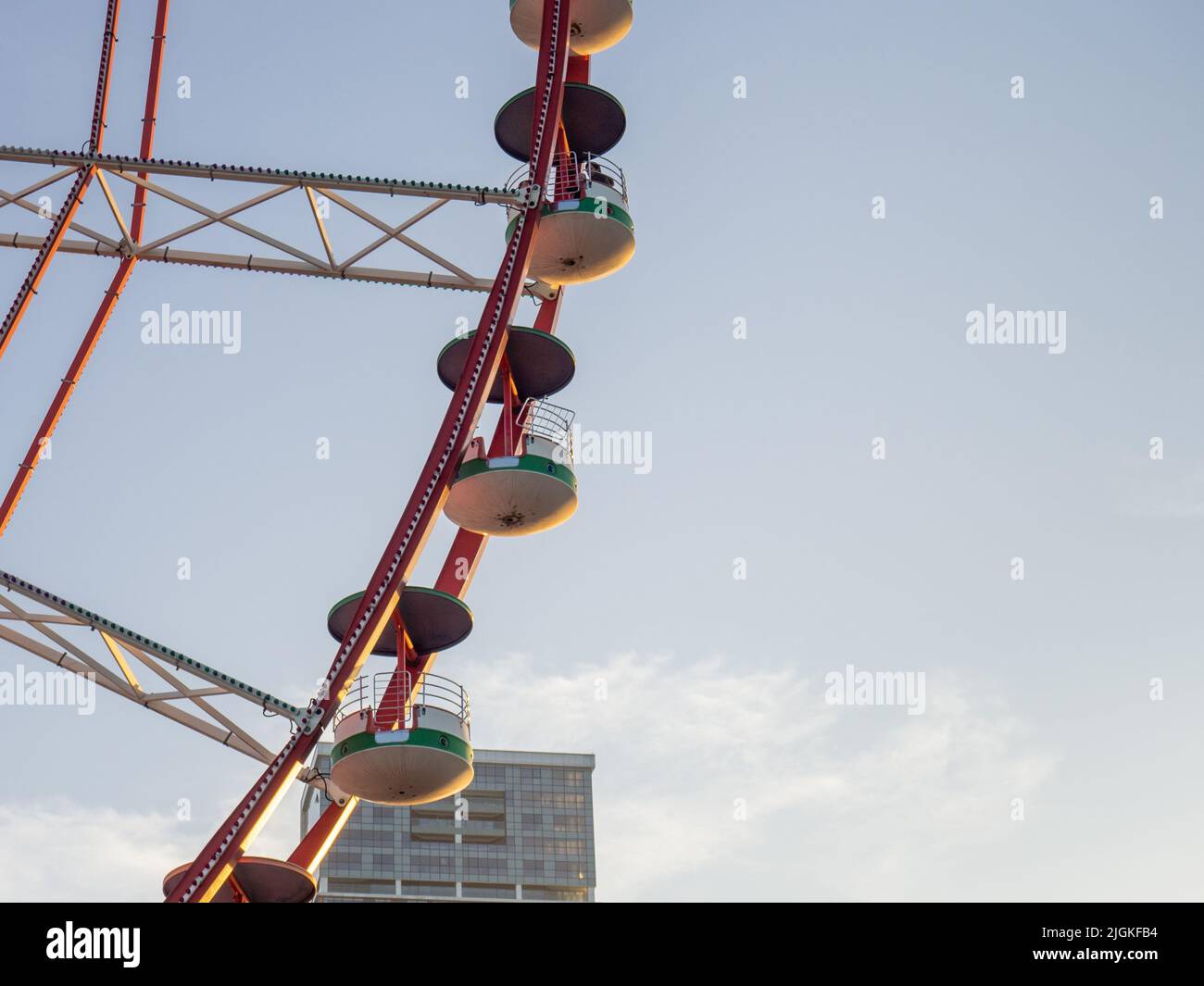 Ferris wheel against the sky. Amusement park by the sea. Rest zone ...
