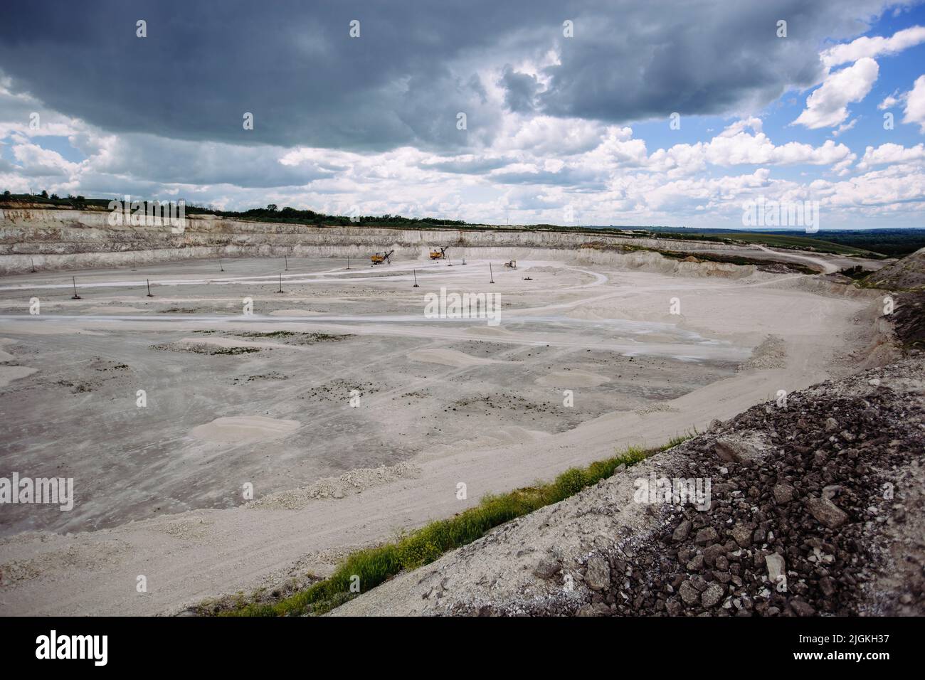 Chalk quarry pit with working excavators Stock Photo - Alamy