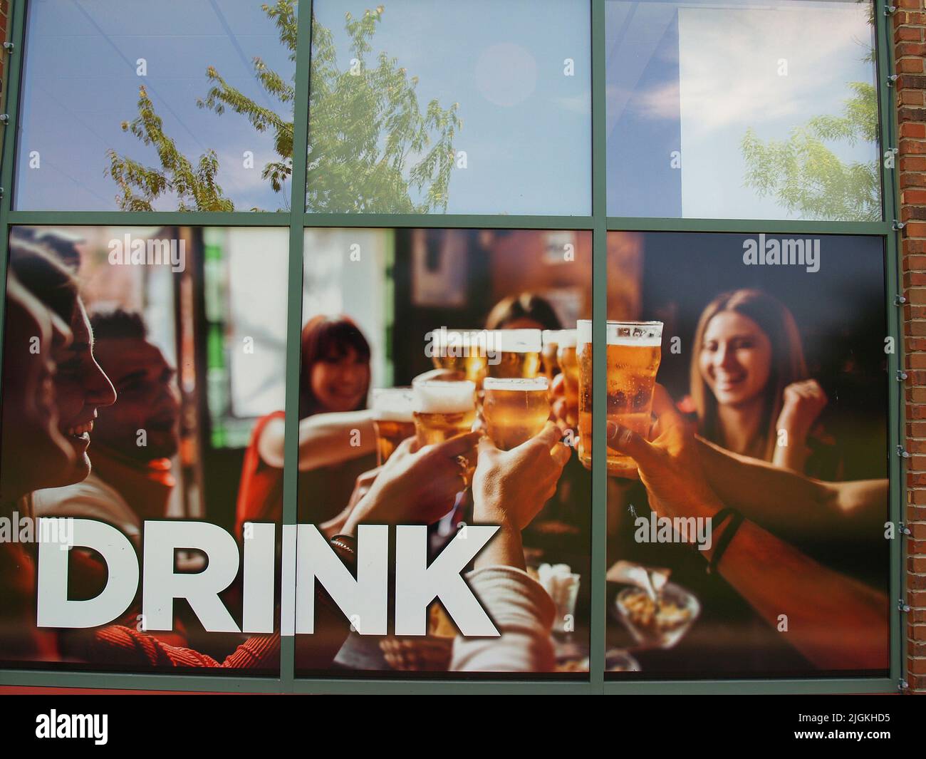 Window advertisement for drinking beer, Charlottetown, PEI Stock Photo ...