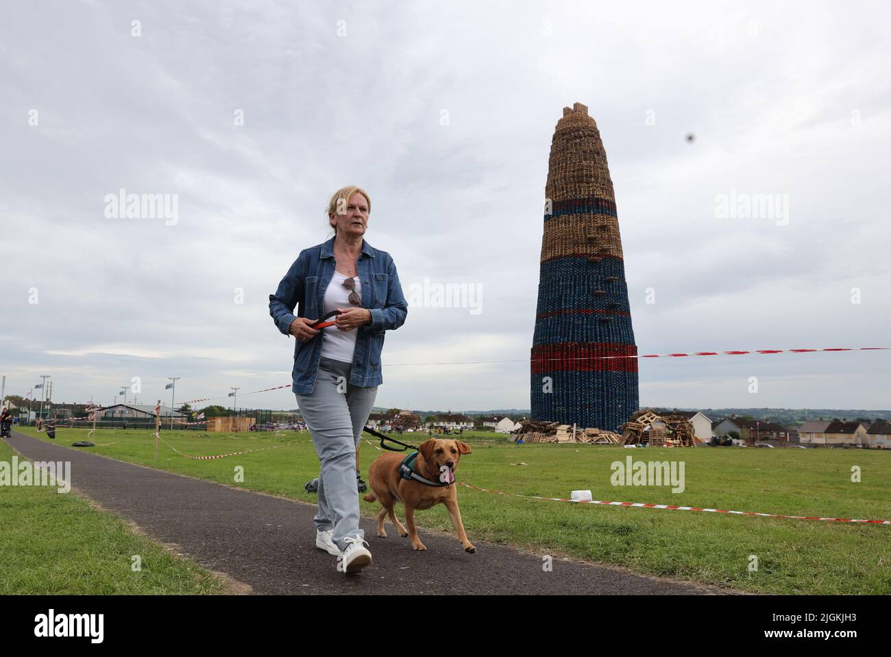 June Raine walks her dog past the Craigyhill bonfire in Larne, prior to ...