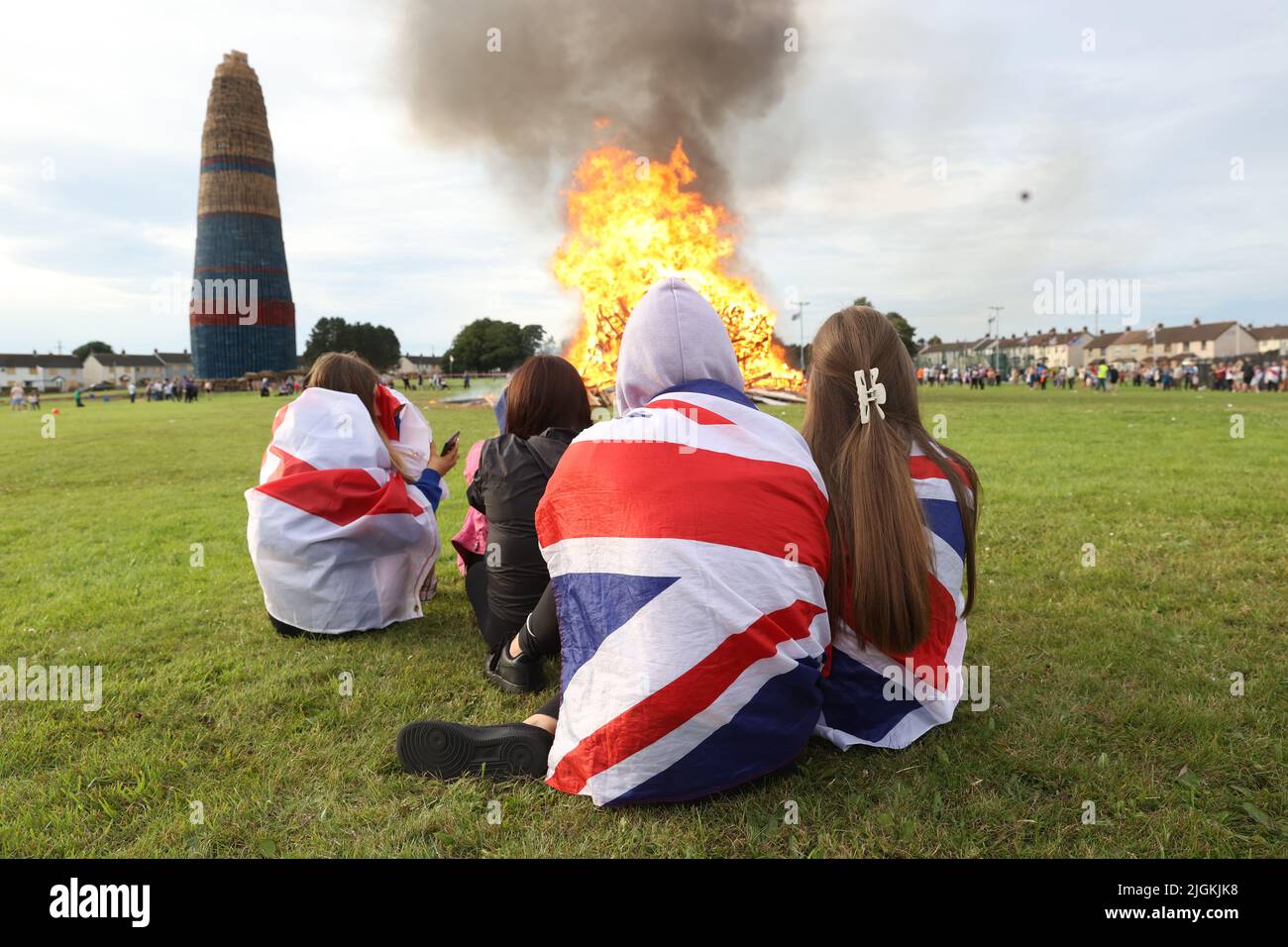 People gather at the Craigyhill bonfire in Larne, prior to it being lit ...